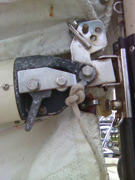 close up of gooseneck fitting with internal reefing and sail tack hooks ...